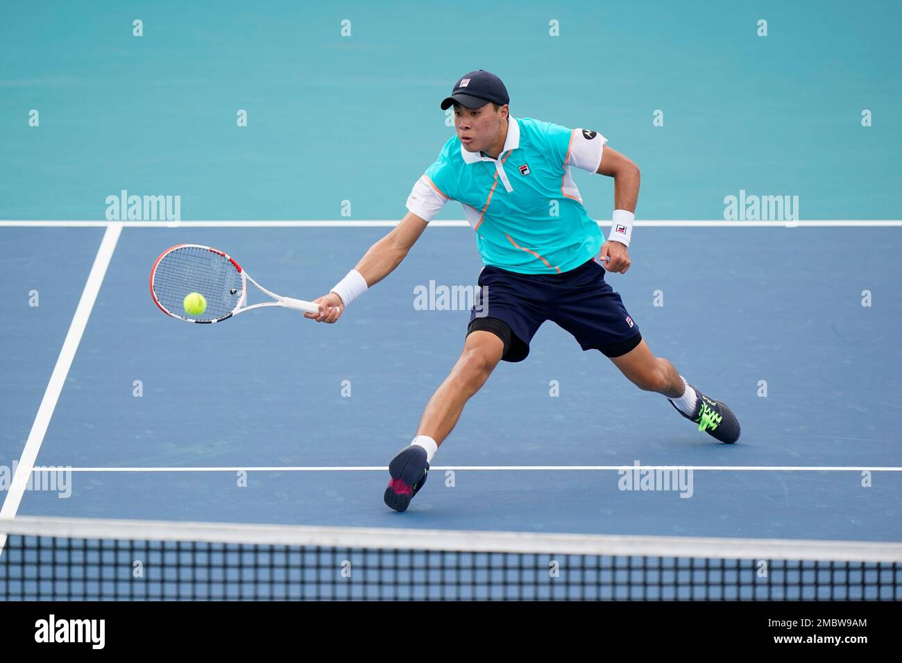 Brandon Nakashima returns a shot from Kwon Soon-woo of South Korea ...