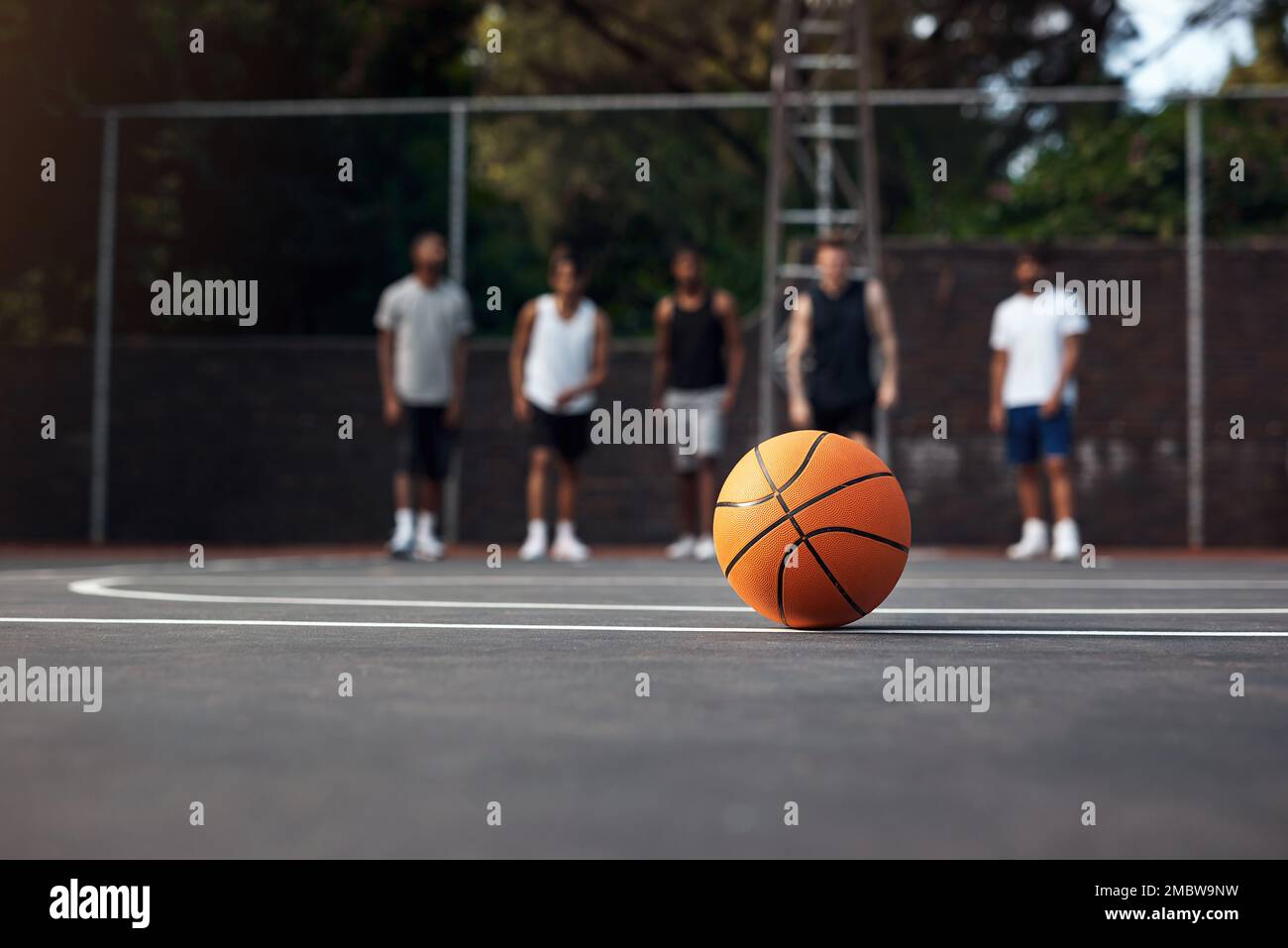 Get the ball and score. Closeup shot of a basketball on a sports court ...