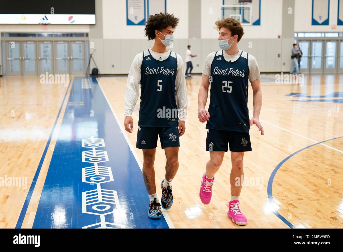 St. Peter's Daryl Banks III, left, and Doug Edert talk while warming-up ...