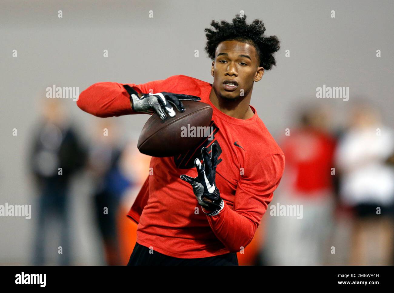 Wide receiver Garrett Wison runs a football drill during Ohio State Pro ...