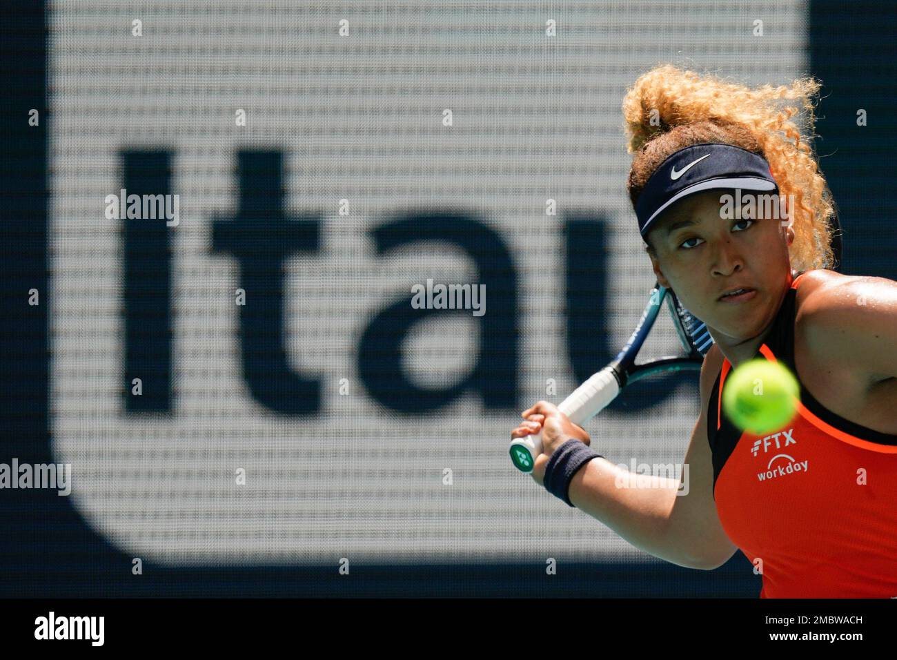 Naomi Osaka of Japan eyes an incoming ball in her first round women's ...