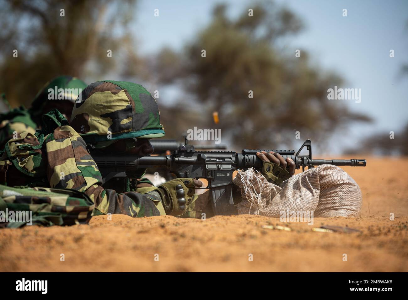 A Senegalese Armed Forces (SAF) soldier practices firing an M-4 carbine ...