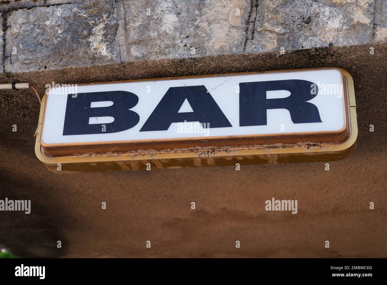 text bar on facade wall front building entrance cafe pub in street ...