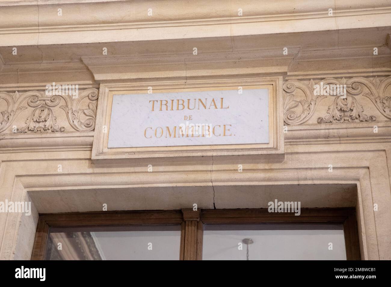 tribunal de commerce text on ancient wall facade building means in ...