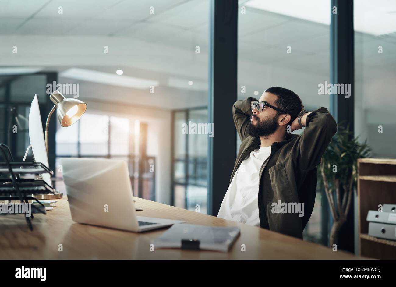 No amount of tired could take me down. a young businessman taking a ...