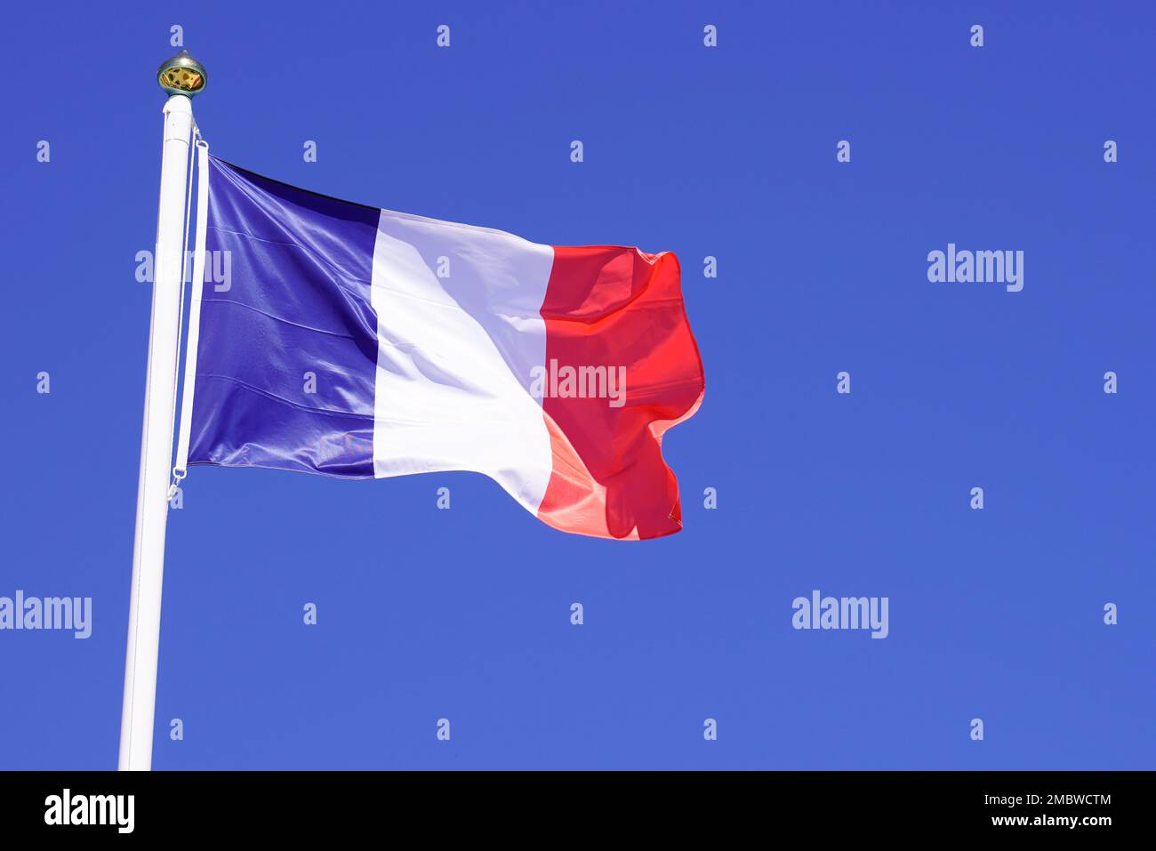 france flag french wave over a blue sky waving on mat Stock Photo - Alamy