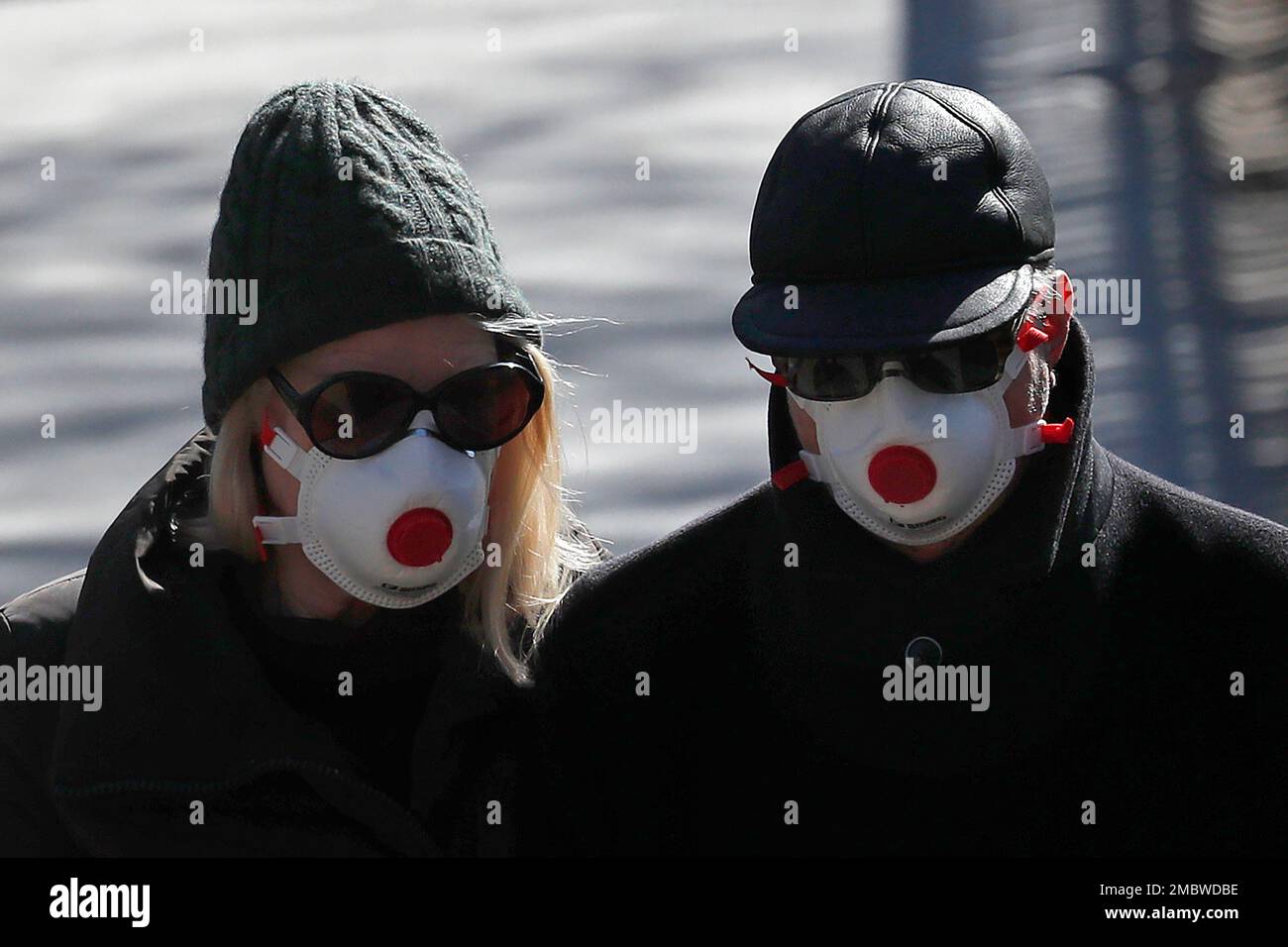 FILE - Two people wearing masks walk in Regents Park in London, Monday ...