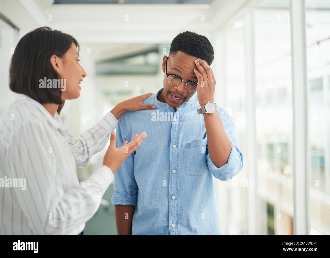 A little support goes a long way. a young businesswoman comforting her ...