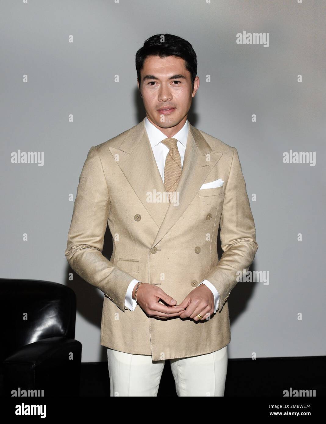 Henry Golding attends the Ralph Lauren Fall/Winter 2022 fashion show at ...