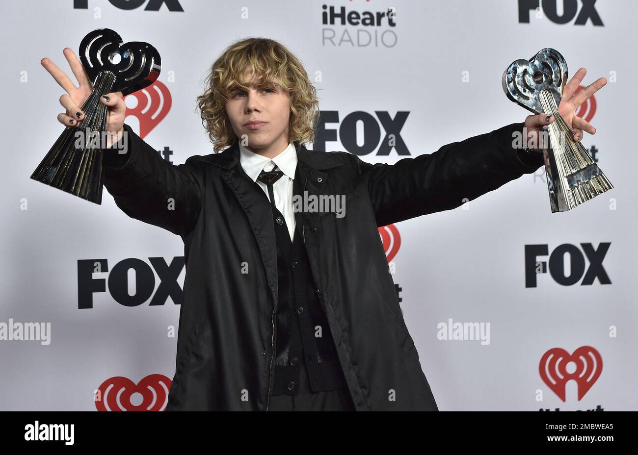 The Kid LAROI poses in the press room with the award for for best ...