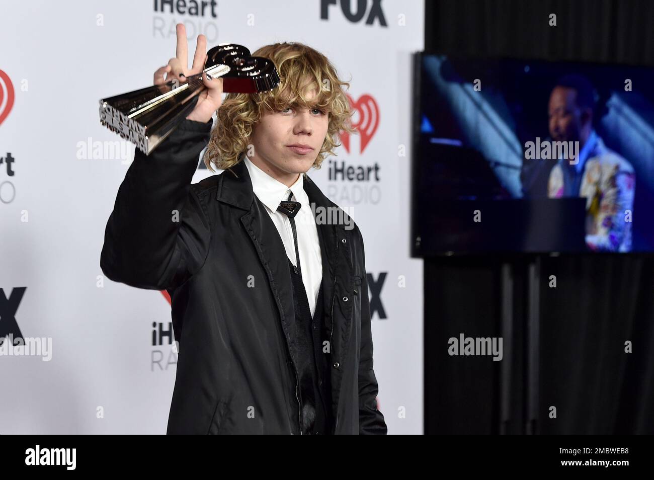 The Kid LAROI poses in the press room with the award for for best ...