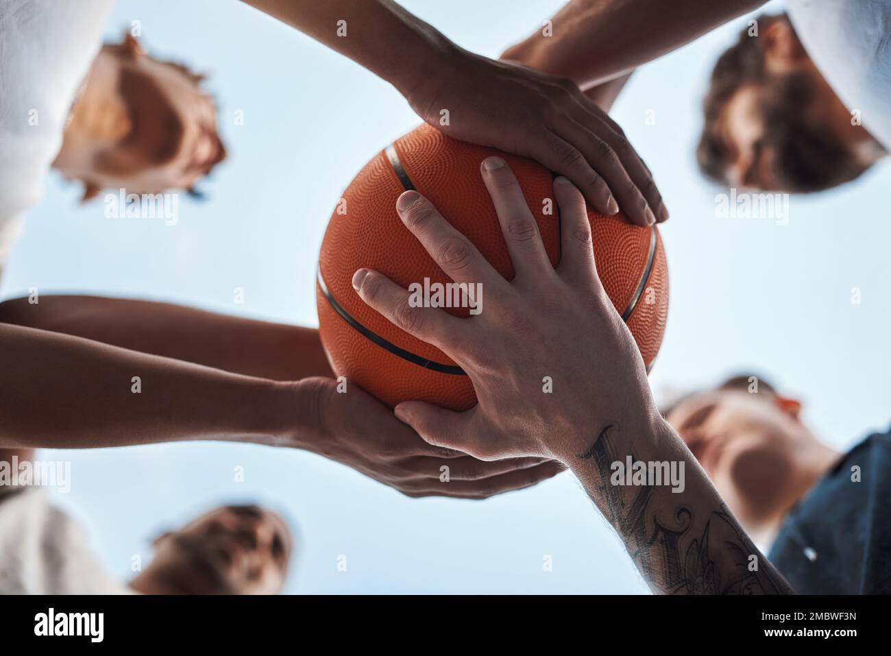 Sport is a great way to teach teamwork. Closeup shot of a group of ...