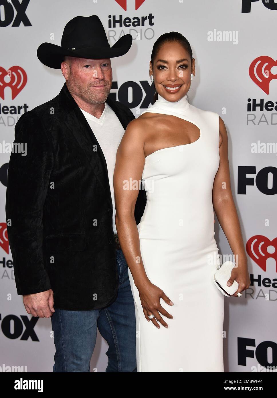 Kevin Wright, left, and Gina Torres arrive at the iHeartRadio Music Awards on Tuesday, March 22 ...