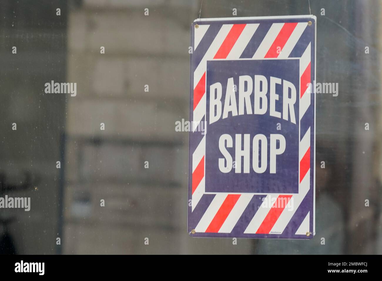 barber shop text sign in wall facade entrance hairdresser in windows ...