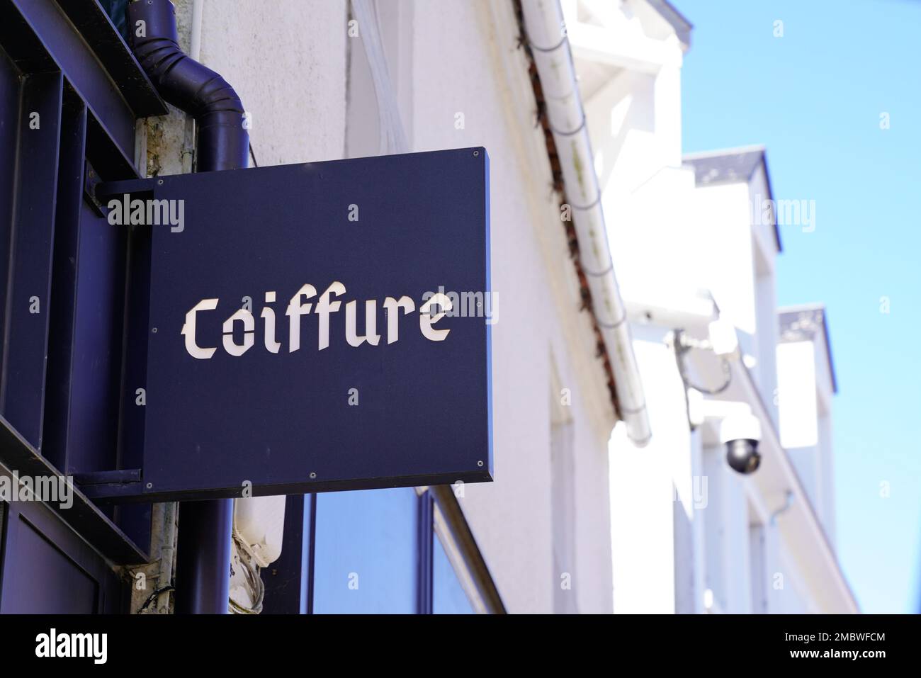 Coiffure text signboard in street means in french hairdresser barber ...