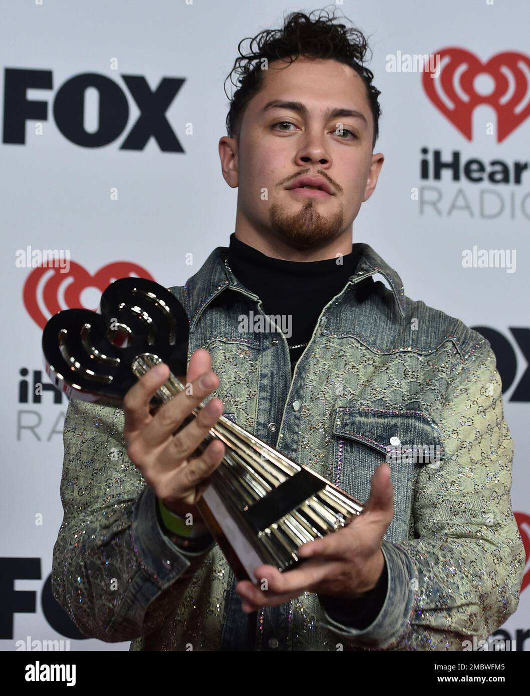 Acraze poses in the press room with the award for dance song of the ...
