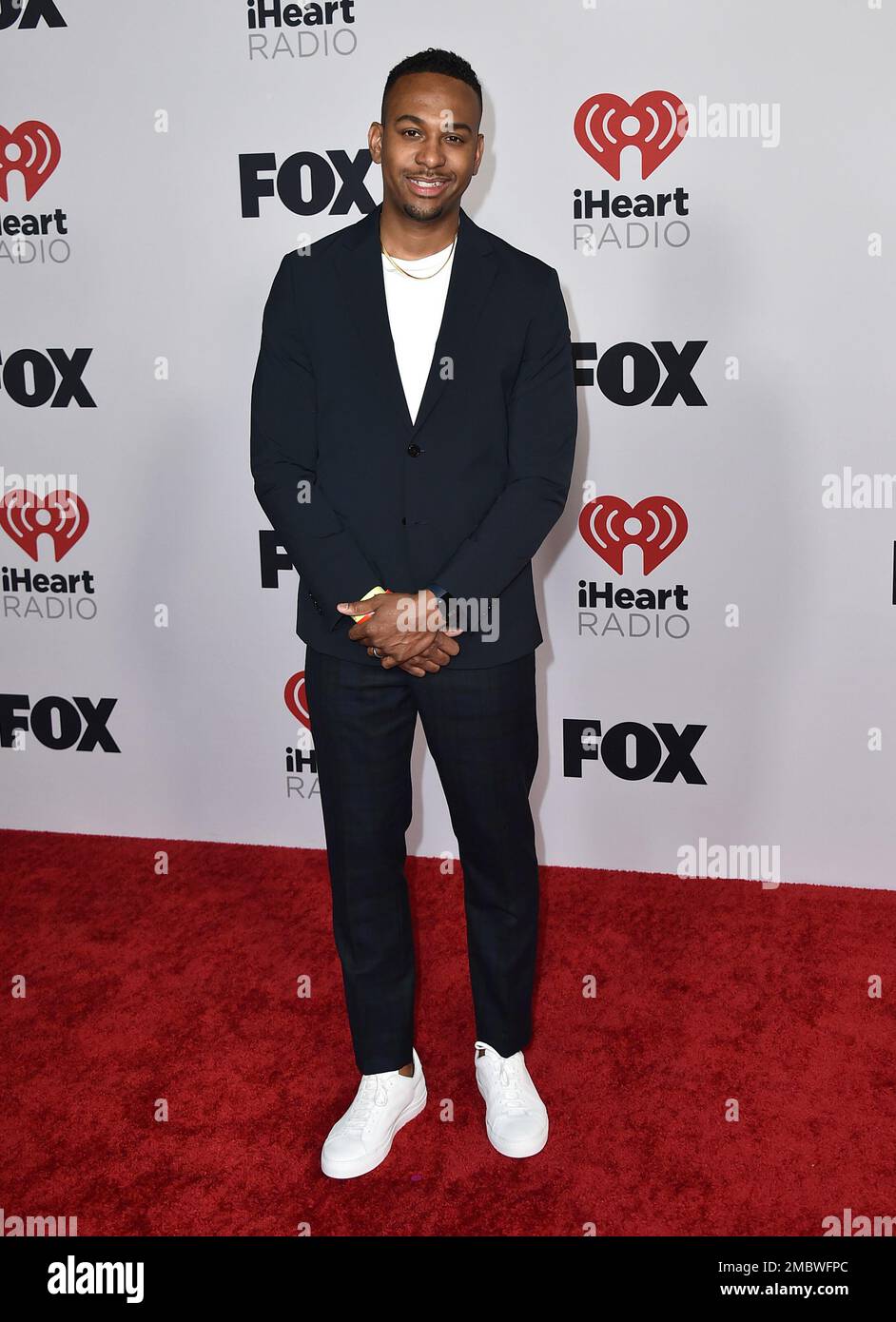 Dr. Cameron Webb arrives at the iHeartRadio Music Awards on Tuesday ...