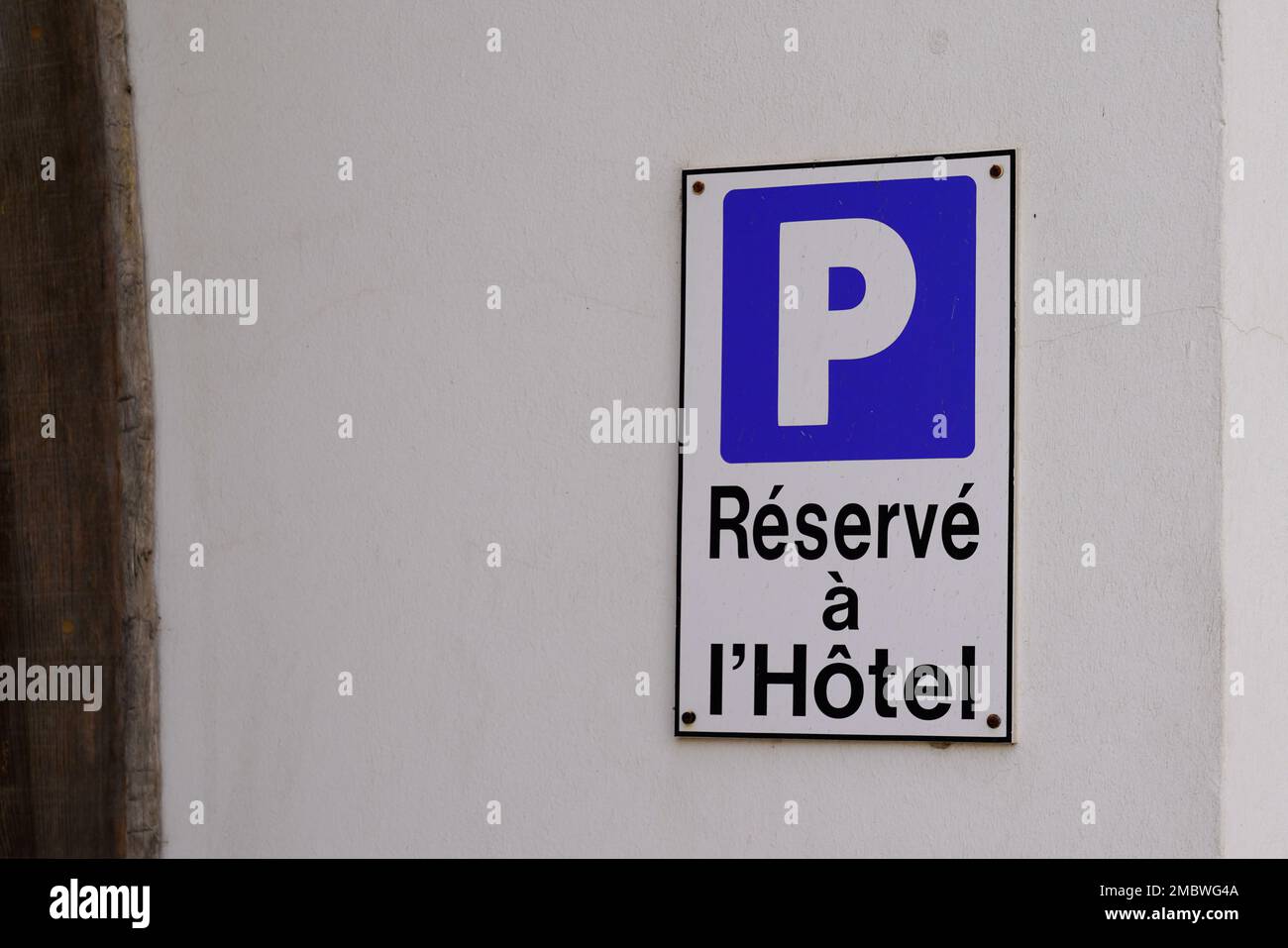 Hotel parking sign with french text means parked car is reserved hostel ...