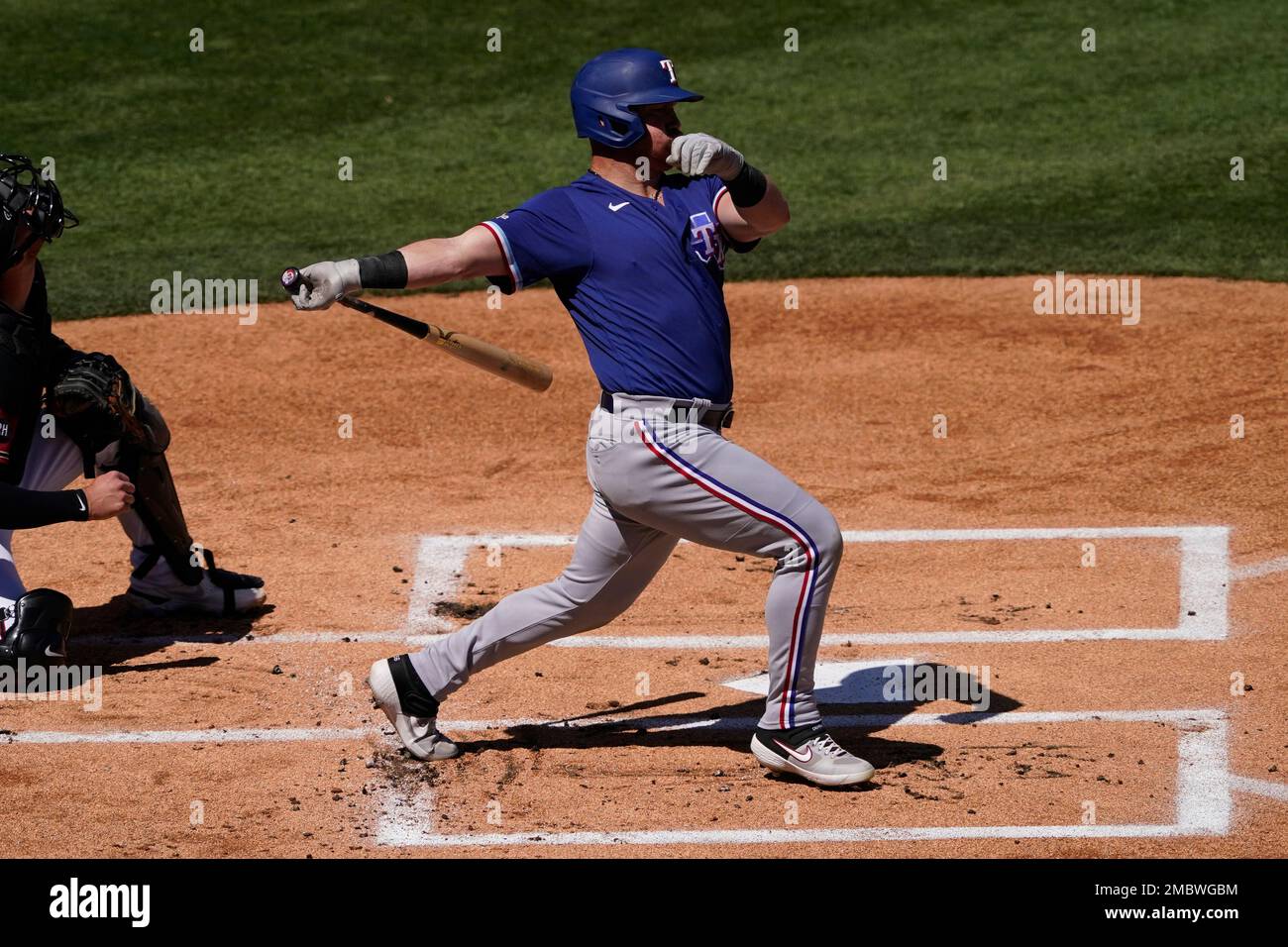Texas Rangers' Kole Calhoun hits against the Arizona Diamondbacks ...