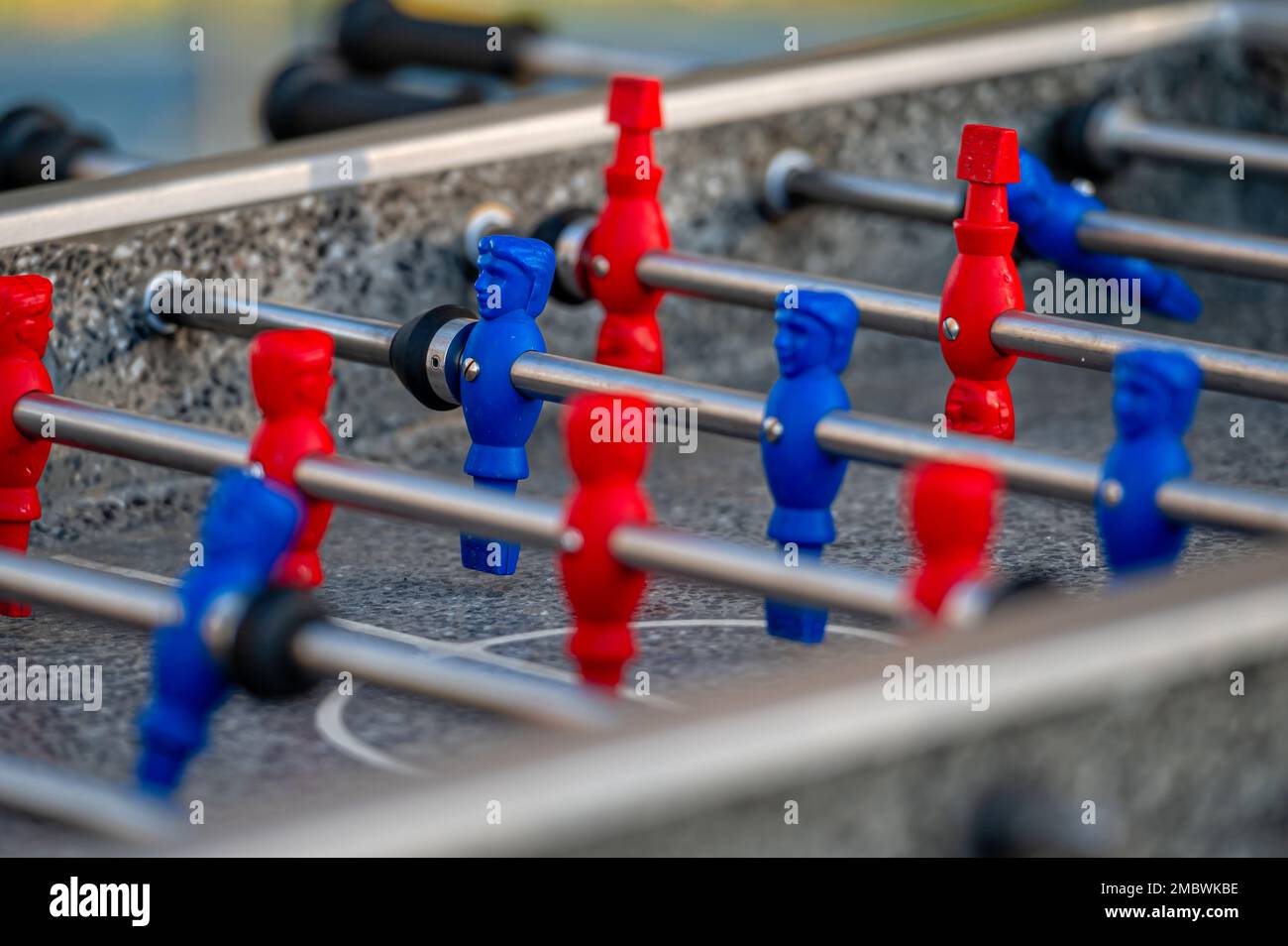 outdoor football table to play football with red and blue players ...