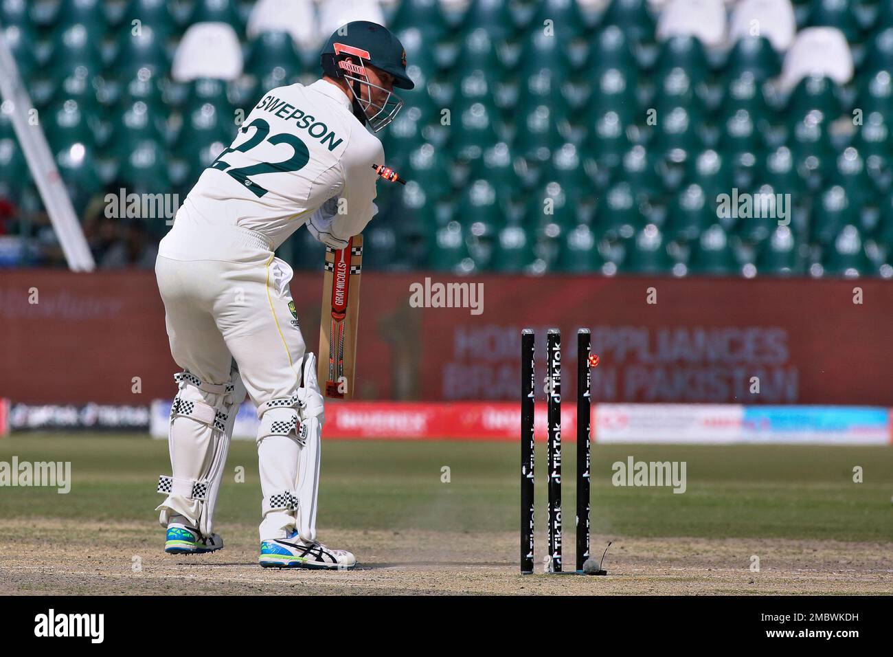 Australia's Mitchell Swepson is bowled out by Pakistan's Shaheen Shah ...