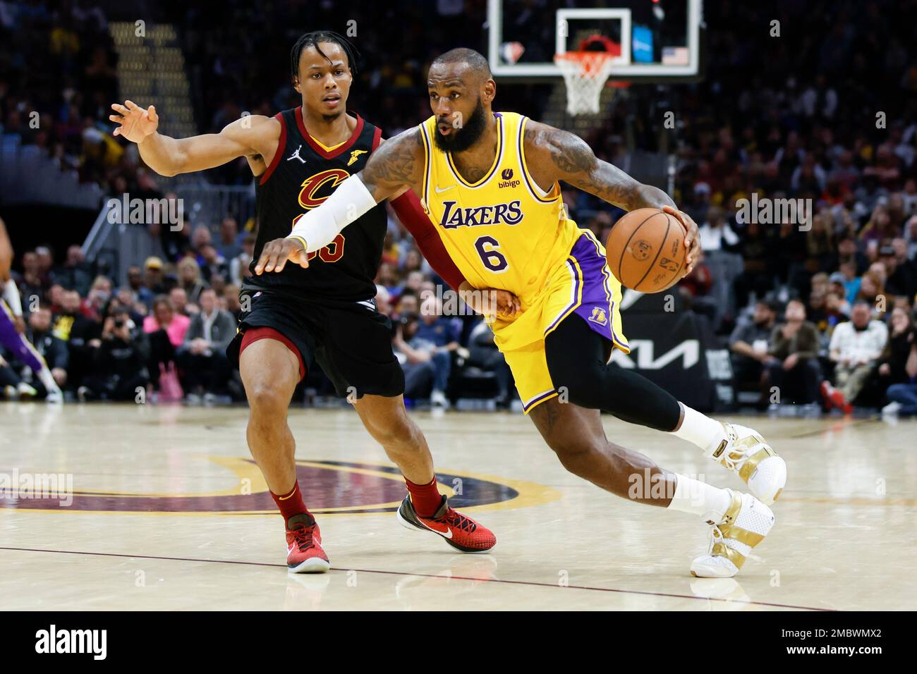 Los Angeles Lakers' LeBron James (6) drives against Cleveland Cavaliers' Isaac Okoro (35) during ...