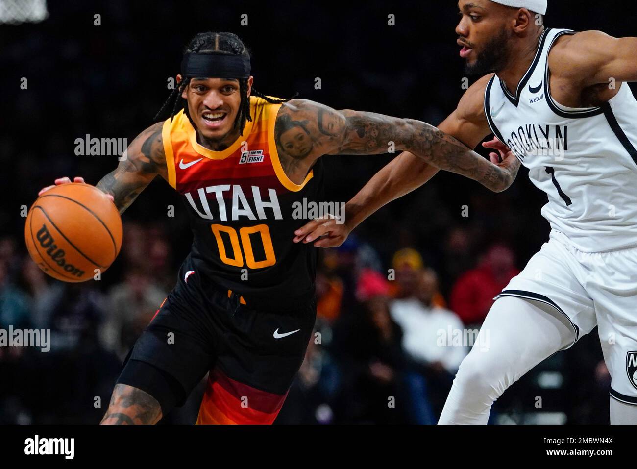 Utah Jazz's Jordan Clarkson (00) drives past Brooklyn Nets' Bruce Brown ...