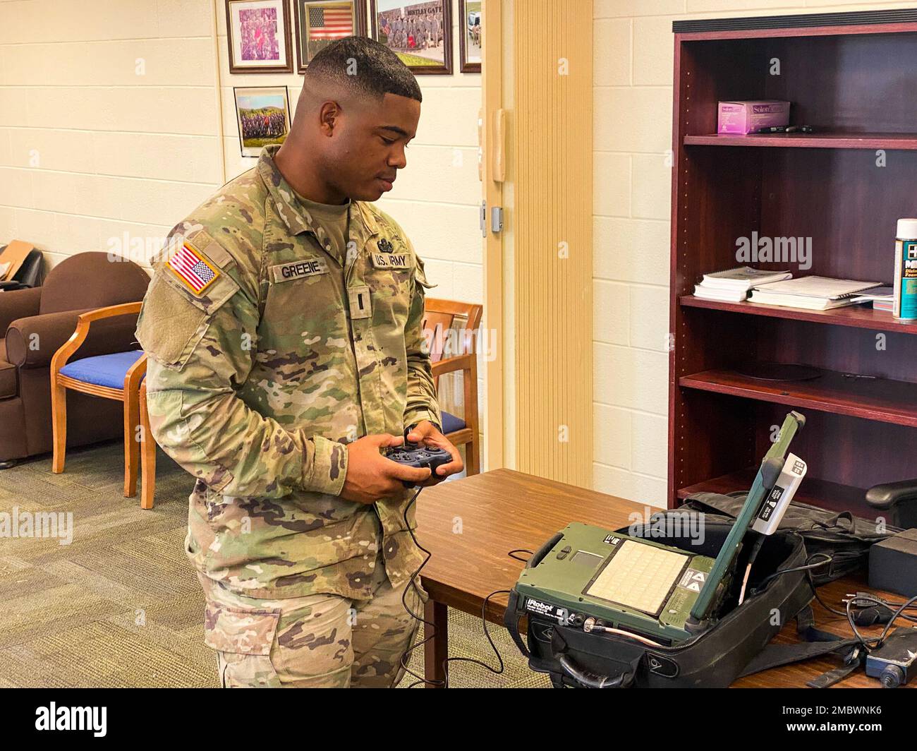 1st Lt. Joel Greene uses a PlayStation controller to control the team's ...