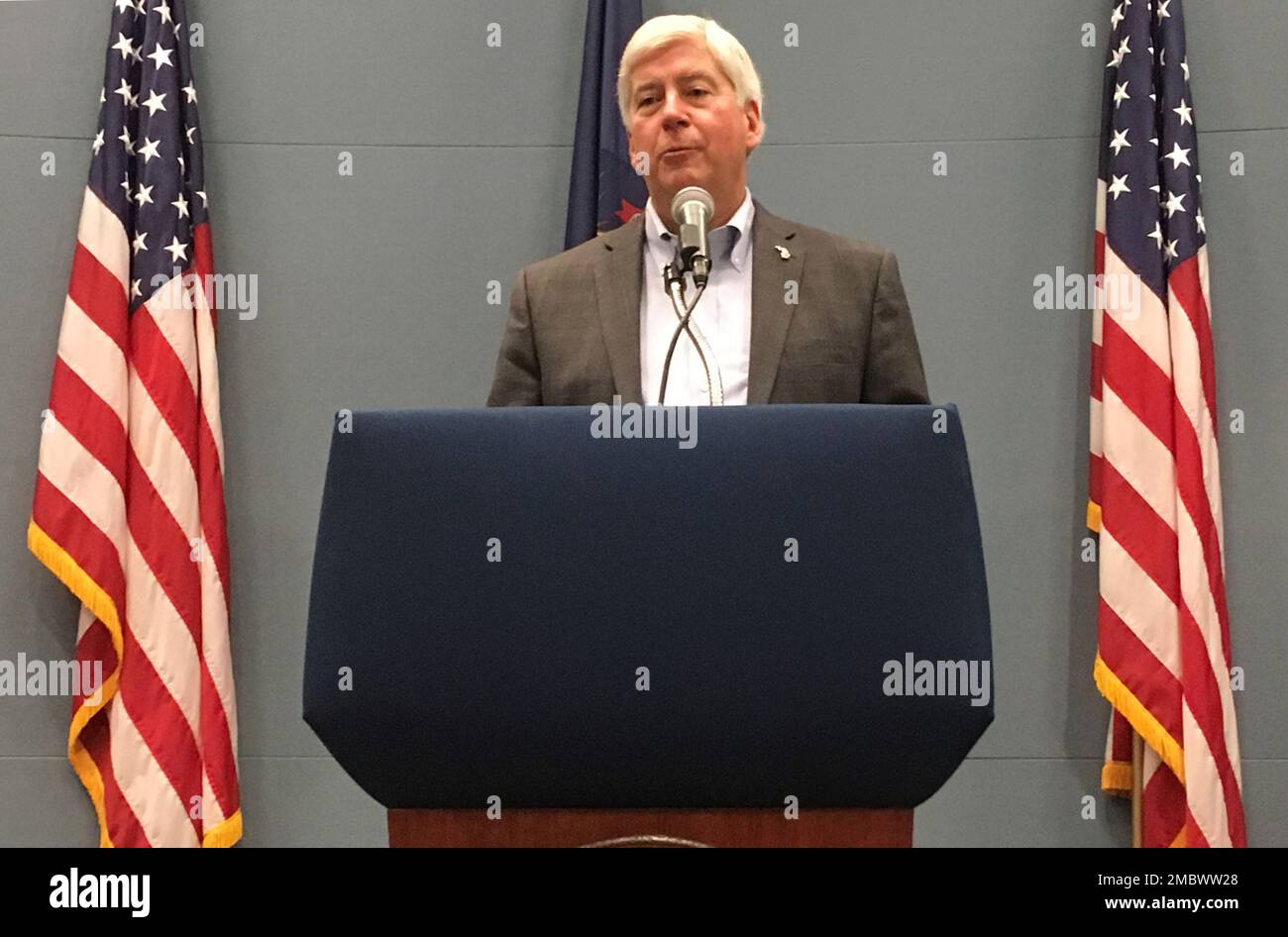 FILE - Then-Michigan Gov. Rick Snyder speaks with reporters during a ...