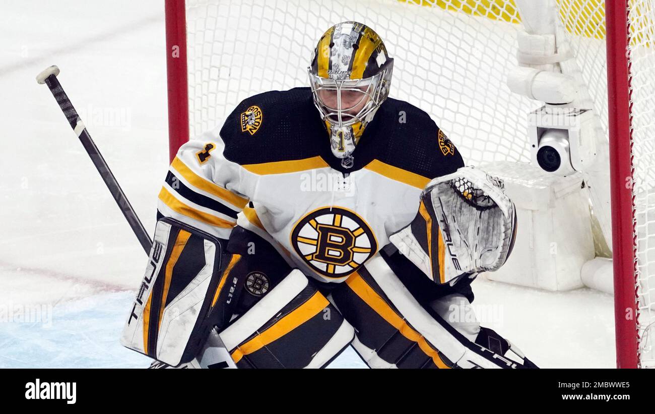 Boston Bruins goalie Jeremy Swayman (1) defends the net in an NHL ...