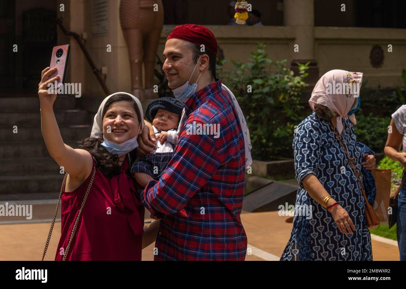 A Parsi family takes selfie after offering prayers at fire temple in ...