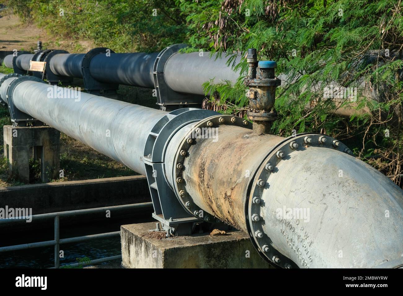 Pipe is installed along the bridge on the pipe support. Water steel ...