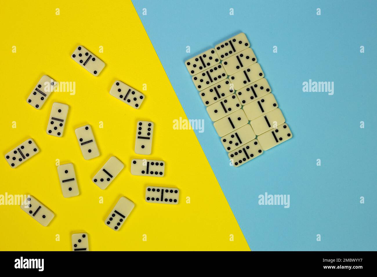 domino strategy game concept, isolated and confused tiles on yellow ...