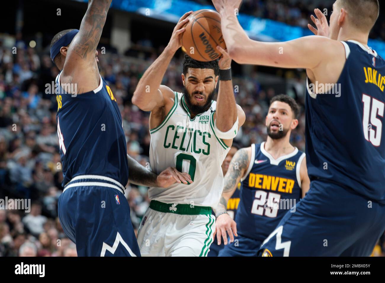 Boston Celtics forward Jayson Tatum, second from left, drives to the basket as, from left to ...