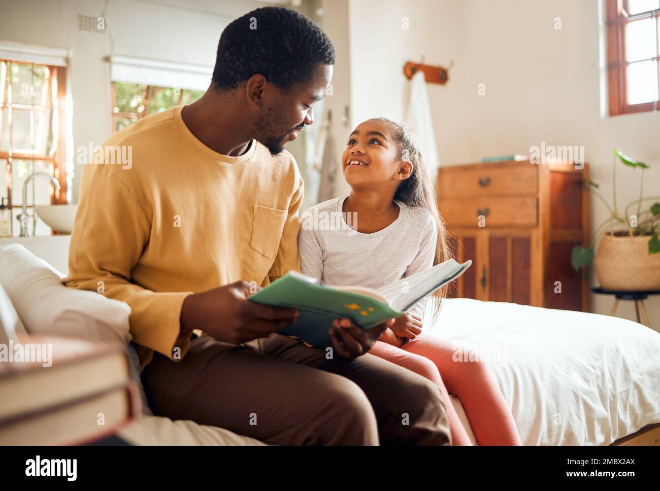 Black family, dad reading book to child for learning, support and ...