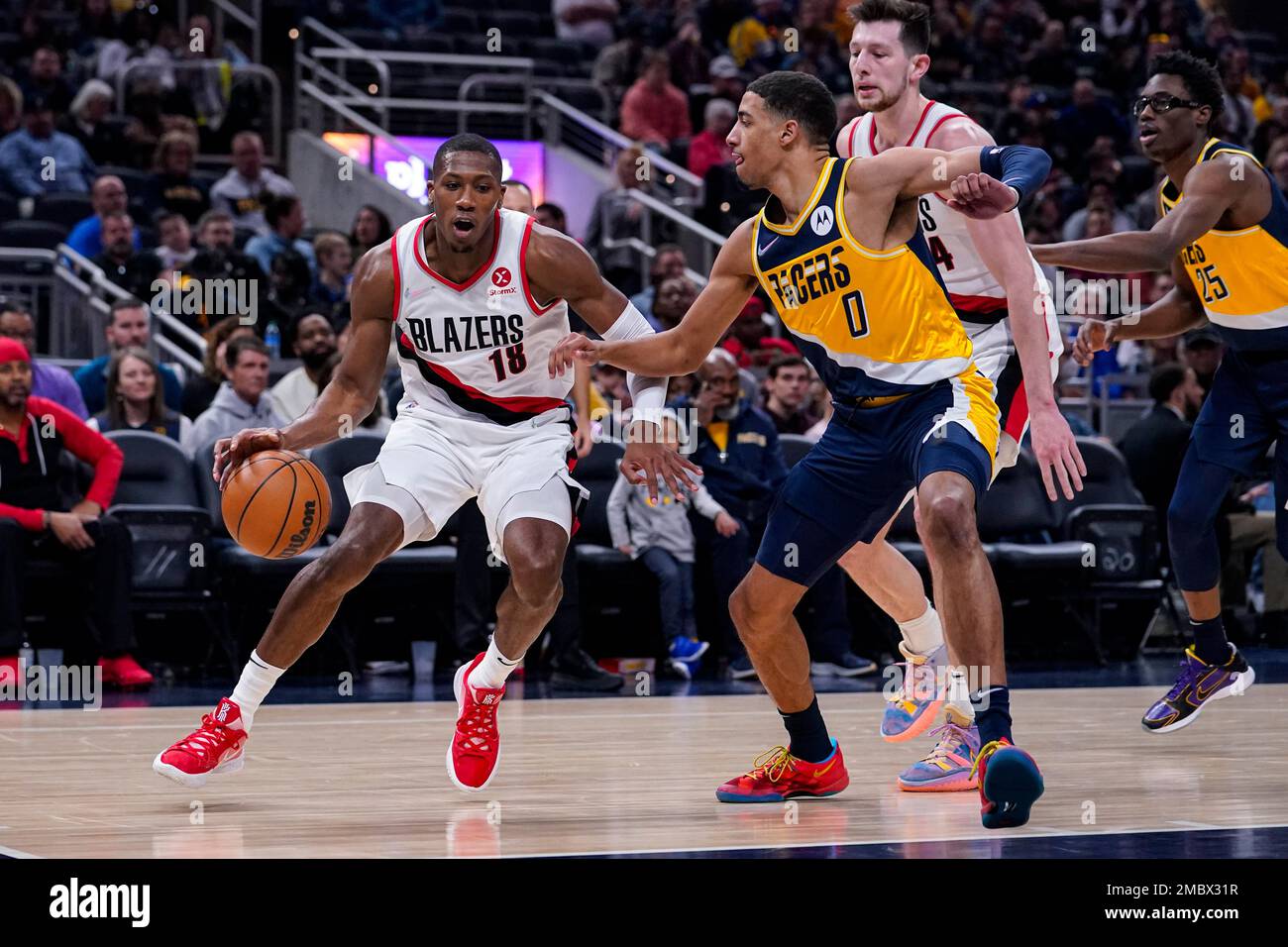 Portland Trail Blazers guard Kris Dunn (18) drives on Indiana Pacers ...