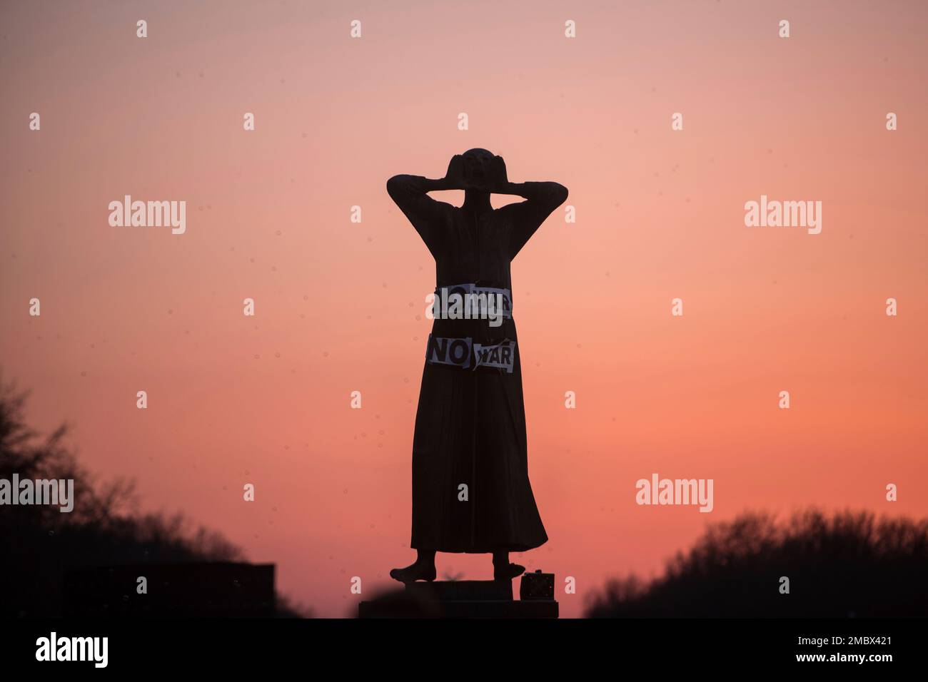 Notes reading No War are stuck to the statue Der Rufer (The Caller) by ...