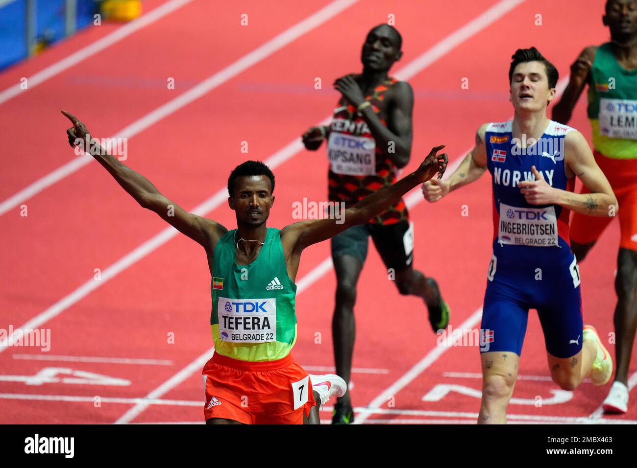 Samuel Tefera, of Ethiopia, reacts as he crosses the finish line ahead ...