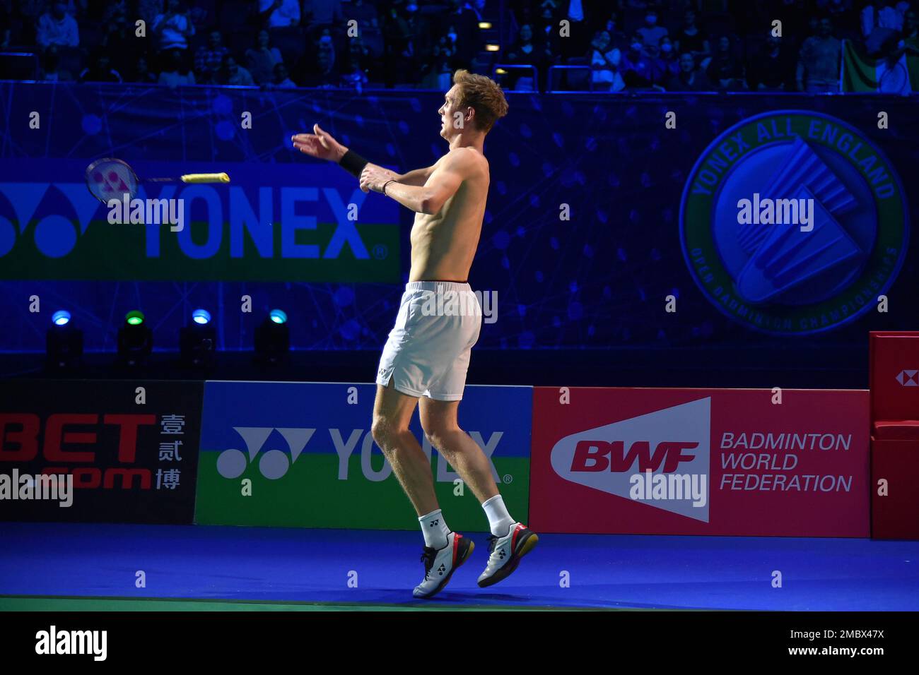 Denmark's Viktor Axelsen throws his racket in celebration after ...