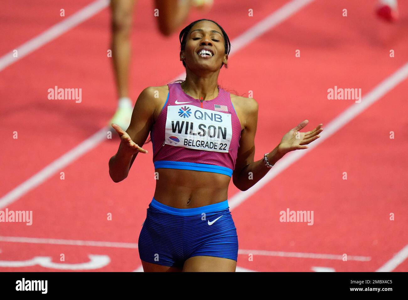 Ajee Wilson, of the United States, reacts as she crosses the finish ...