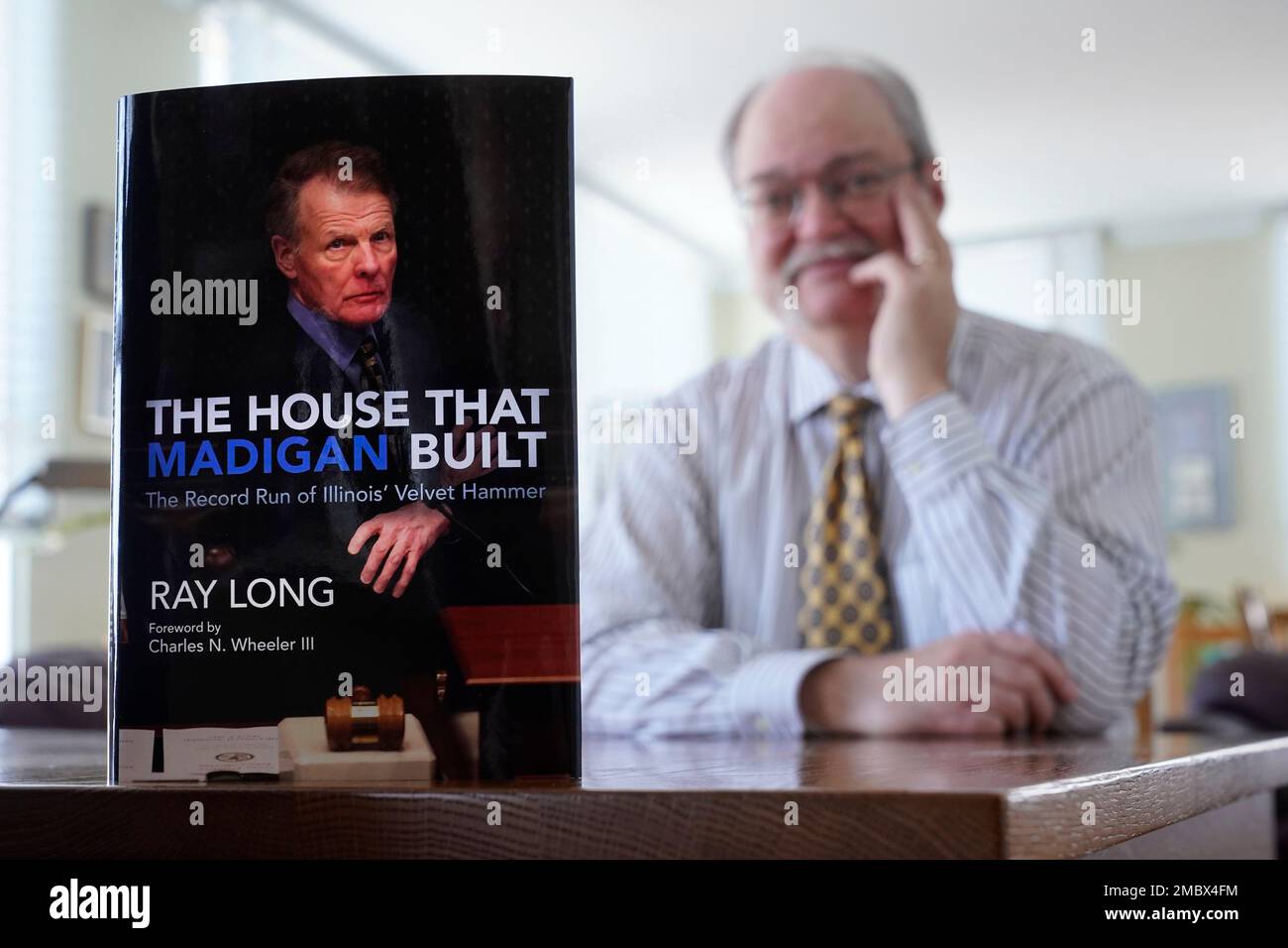 Chicago Tribune investigative reporter Ray Long poses for a portrait ...