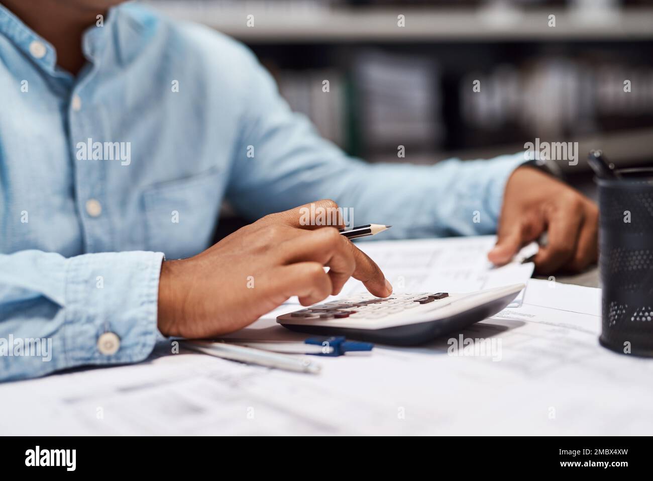 Every Calculation Makes A Difference An Architect Using A Calculator While Drawing Up A