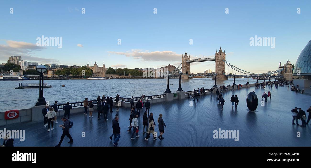 A high-angle view of people walking near the London Bridge tower over ...