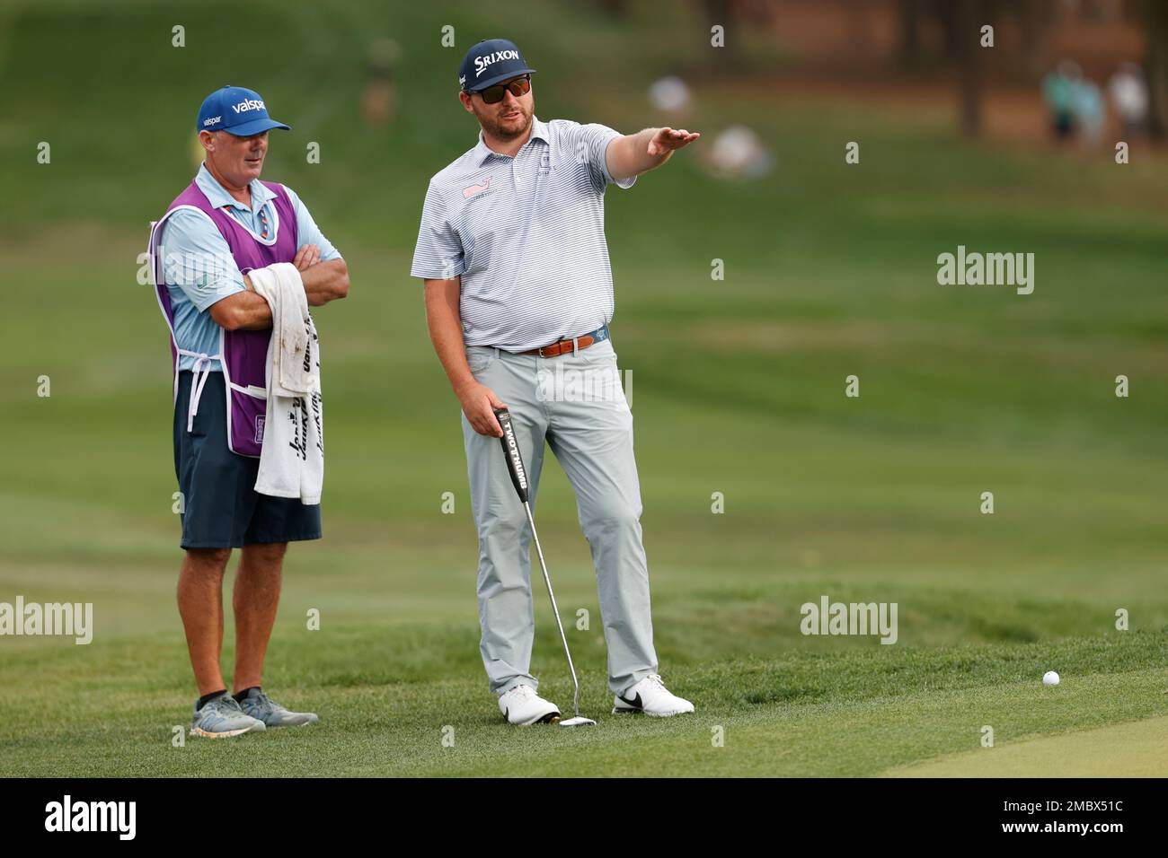 Matthew NeSmith talks with his caddie during the third round of the ...
