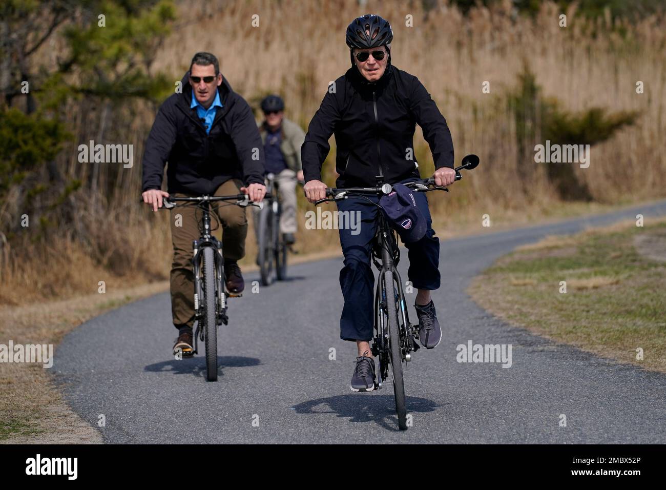 President Joe Biden rides a bicycle in Gordon's Pond State Park in ...