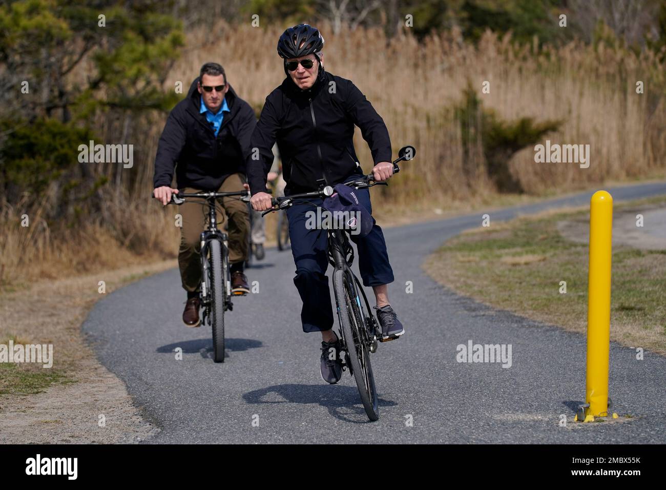 President Joe Biden rides a bicycle in Gordon's Pond State Park in ...