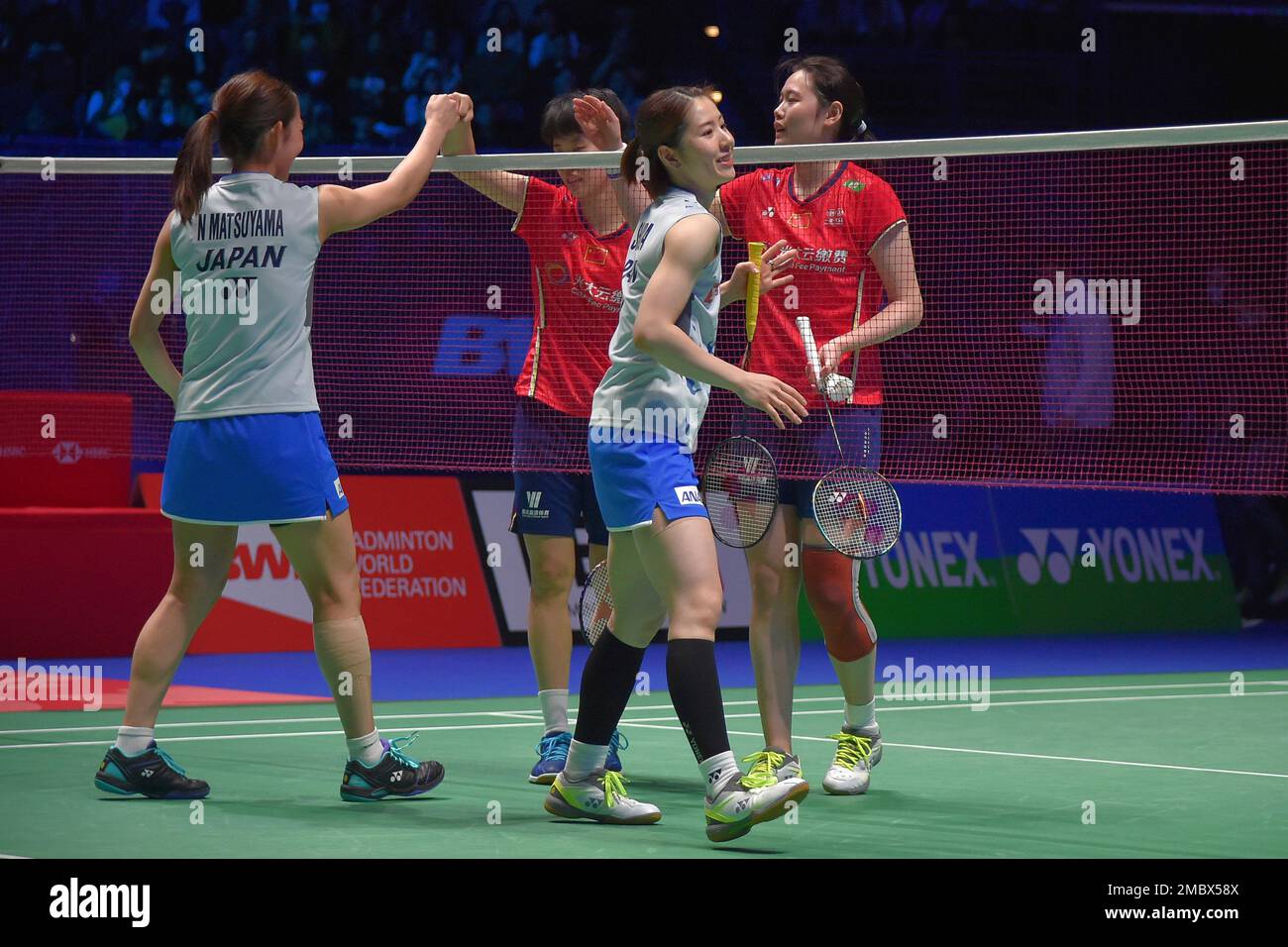 Japan's Nami Matsuyama, left, and Chiharu Shida shakes hands with China's Zhang Shu Xian and ...