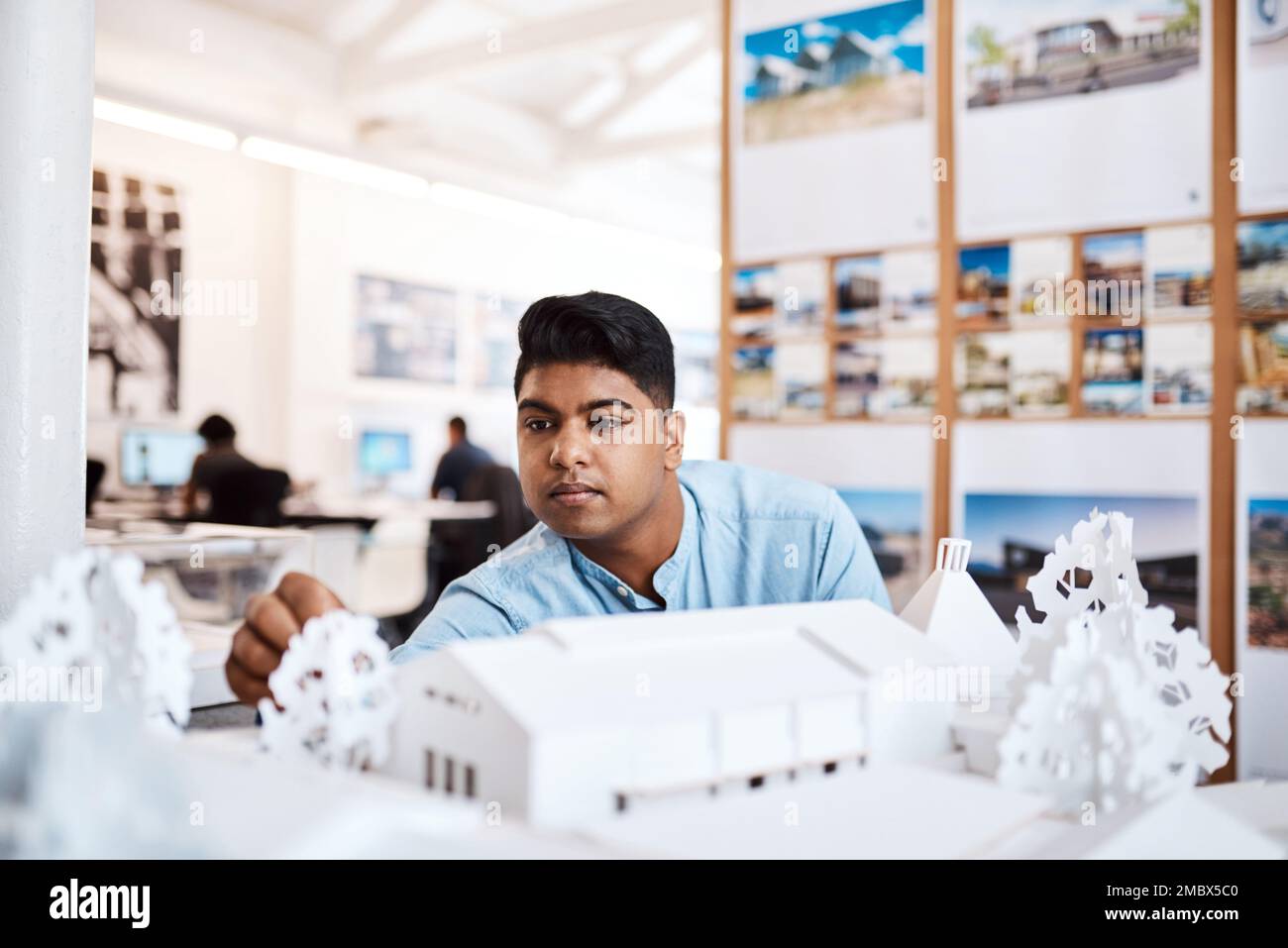 The brains behind an iconic building. a young architect designing a ...