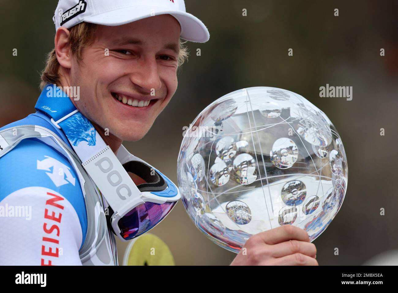 Switzerland's Marco Odermatt holds the trophy for the alpine ski men's ...