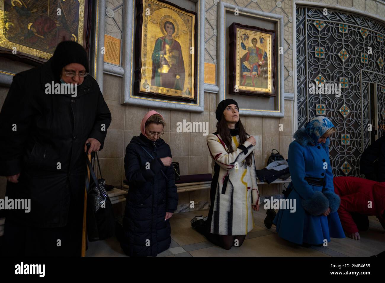Woman pray inside the "Transfiguration of Jesus" Orthodox Cathedral, in ...